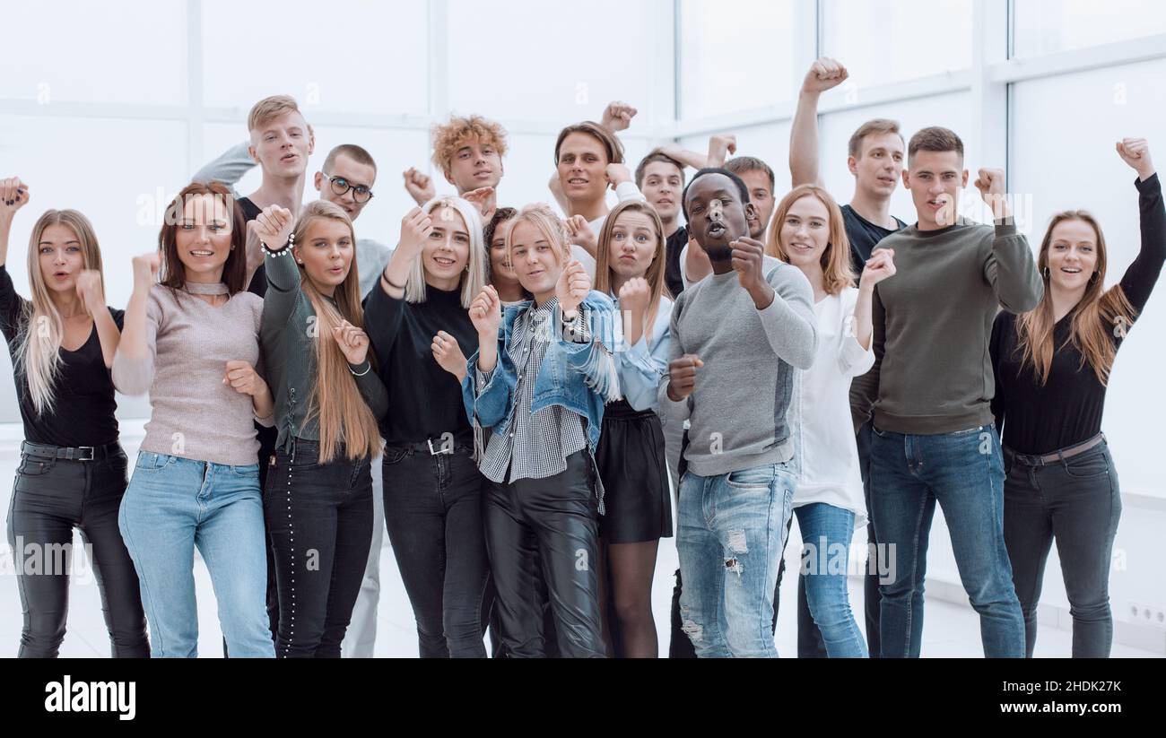 large group of happy young people showing their success Stock Photo - Alamy
