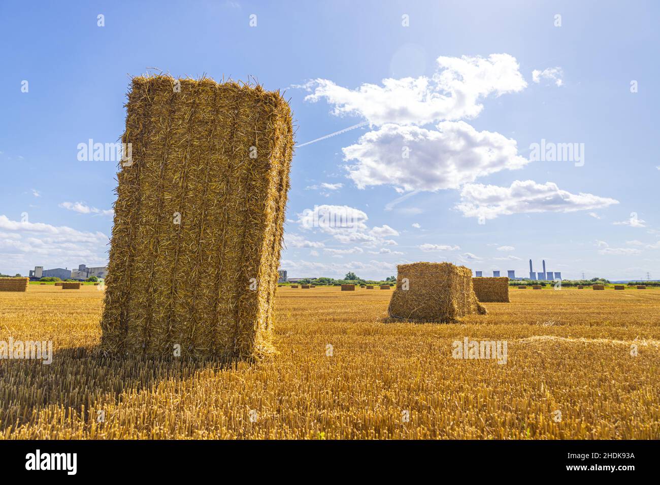 A large hay bail that has been harvested in a farmer's field, in the ...