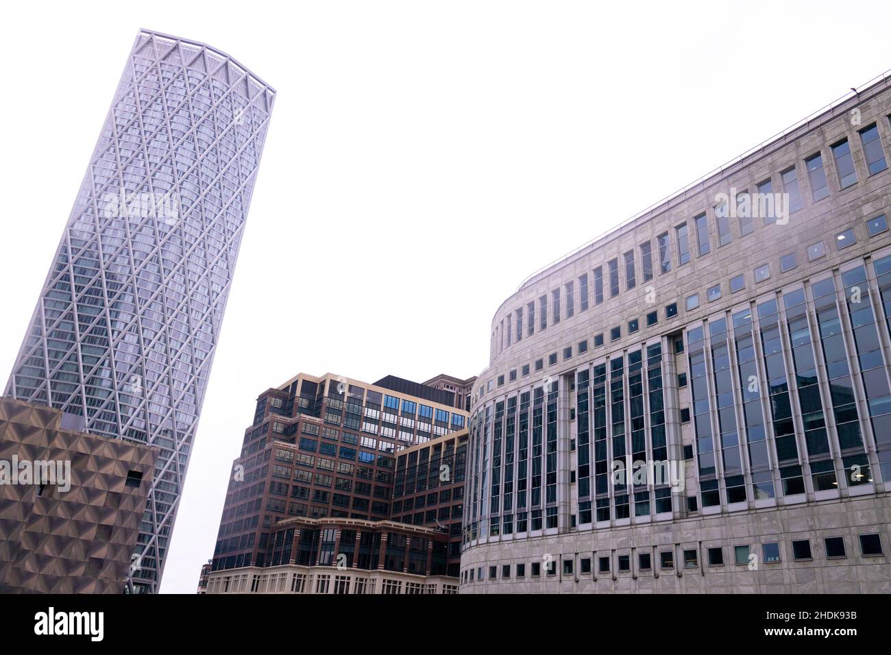 A ground perspective of some high rise buildings in the middle of a ...