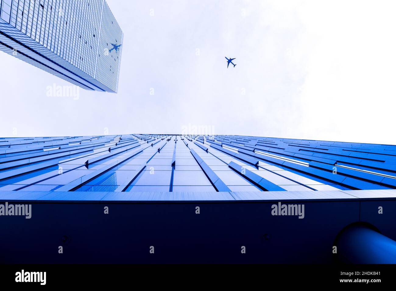 A ground perspective of some high rise buildings in the middle of a ...