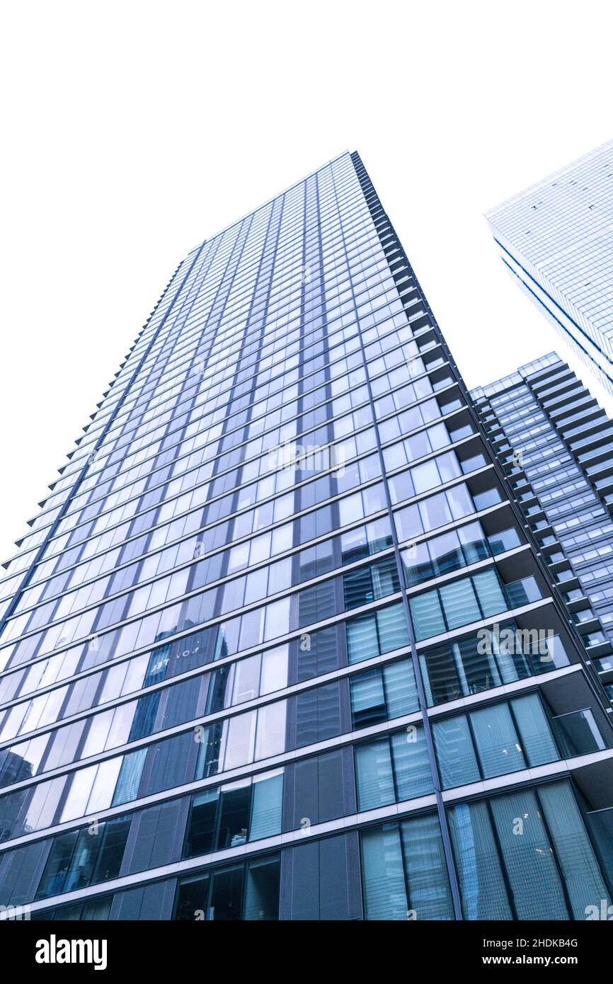 A ground perspective of some high rise buildings in the middle of a ...