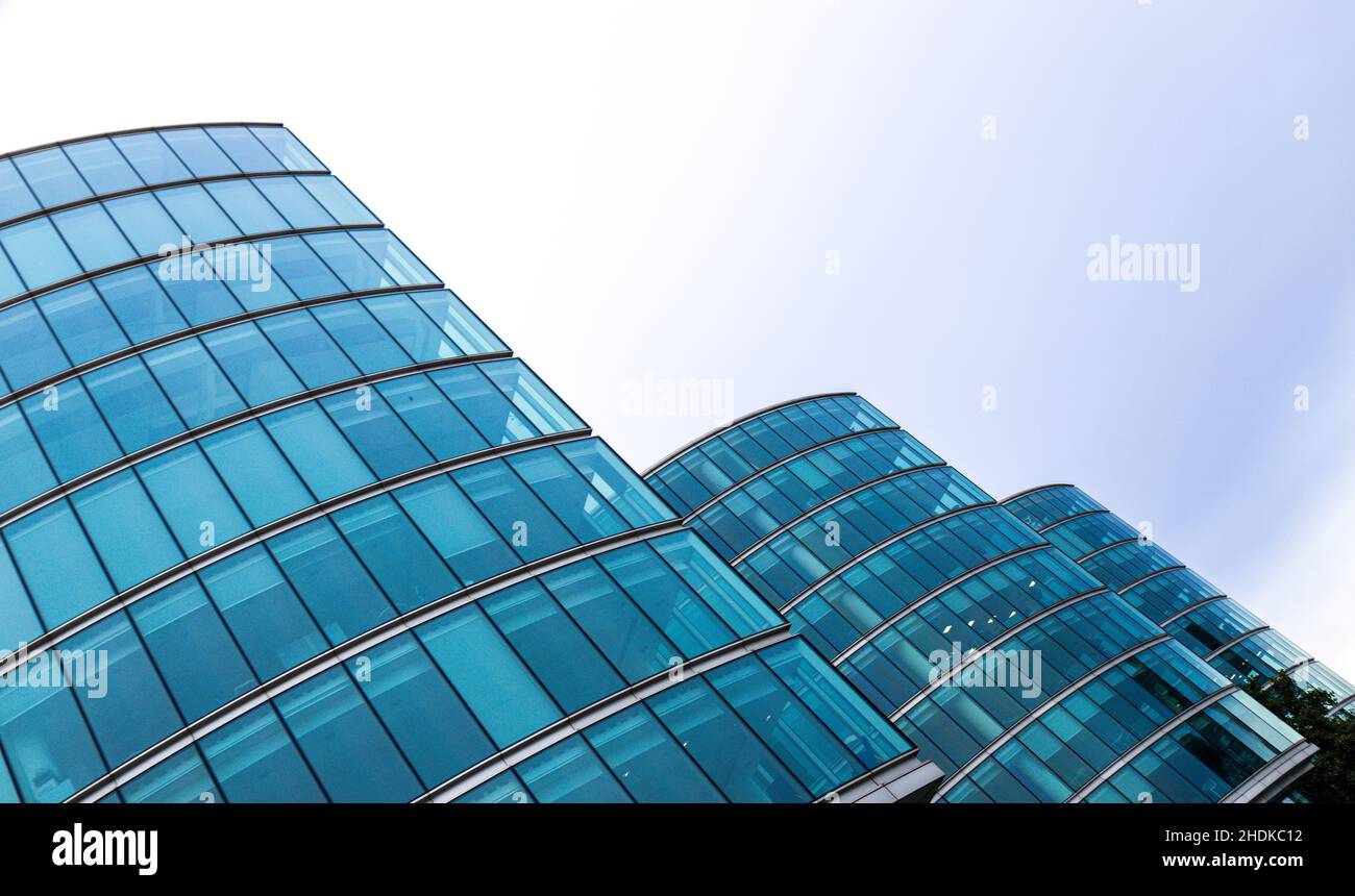 A ground perspective of some high rise buildings in the middle of a ...