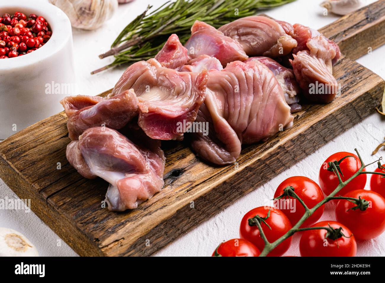 Raw chicken stomach set, on white stone table background Stock Photo ...