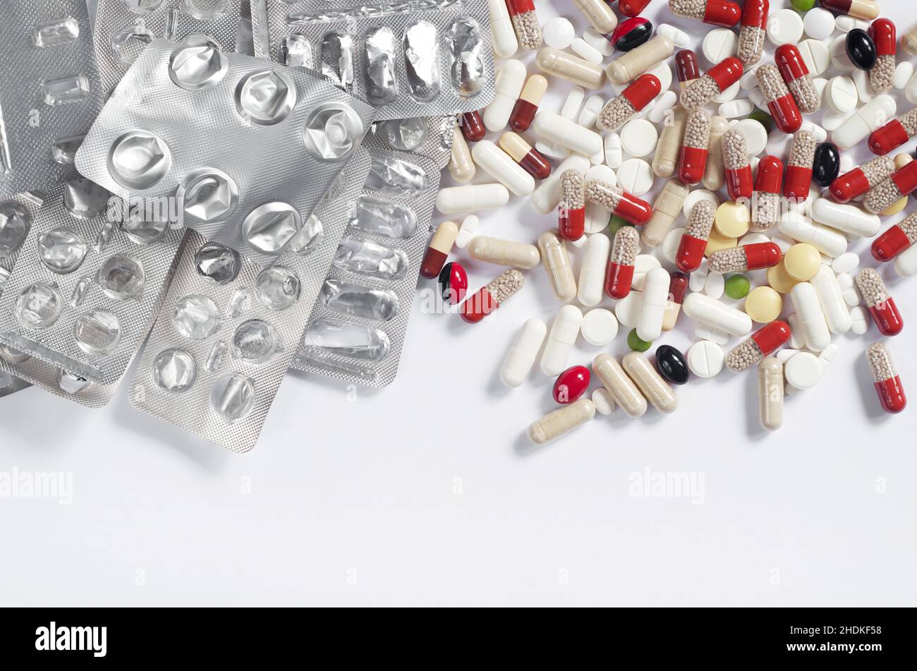 Medical capsules, empty blisters and pills on white background, top ...