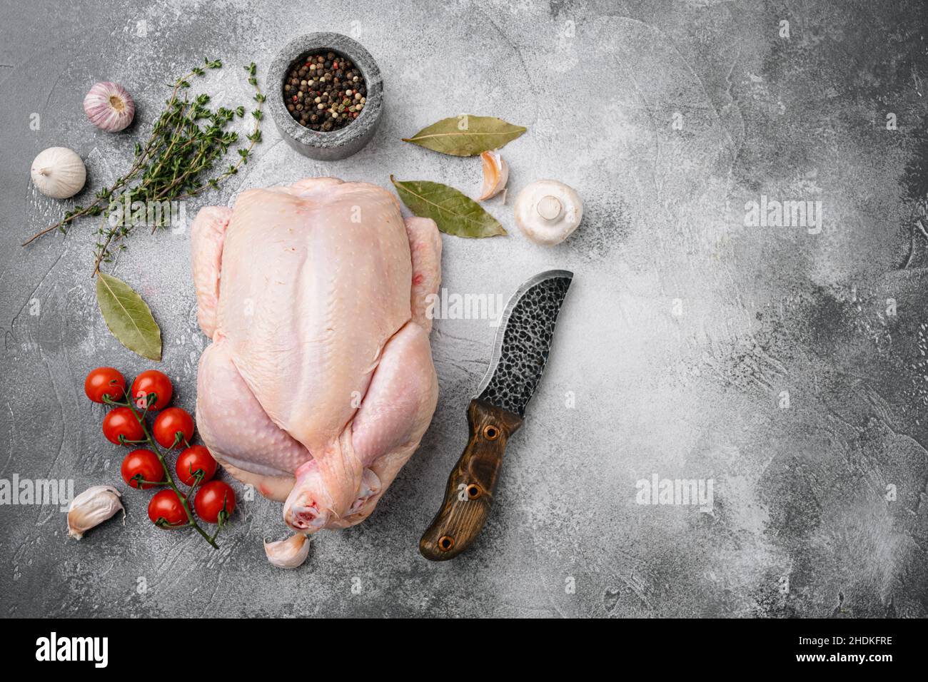Whole raw chicken set, on gray stone table background, top view flat ...