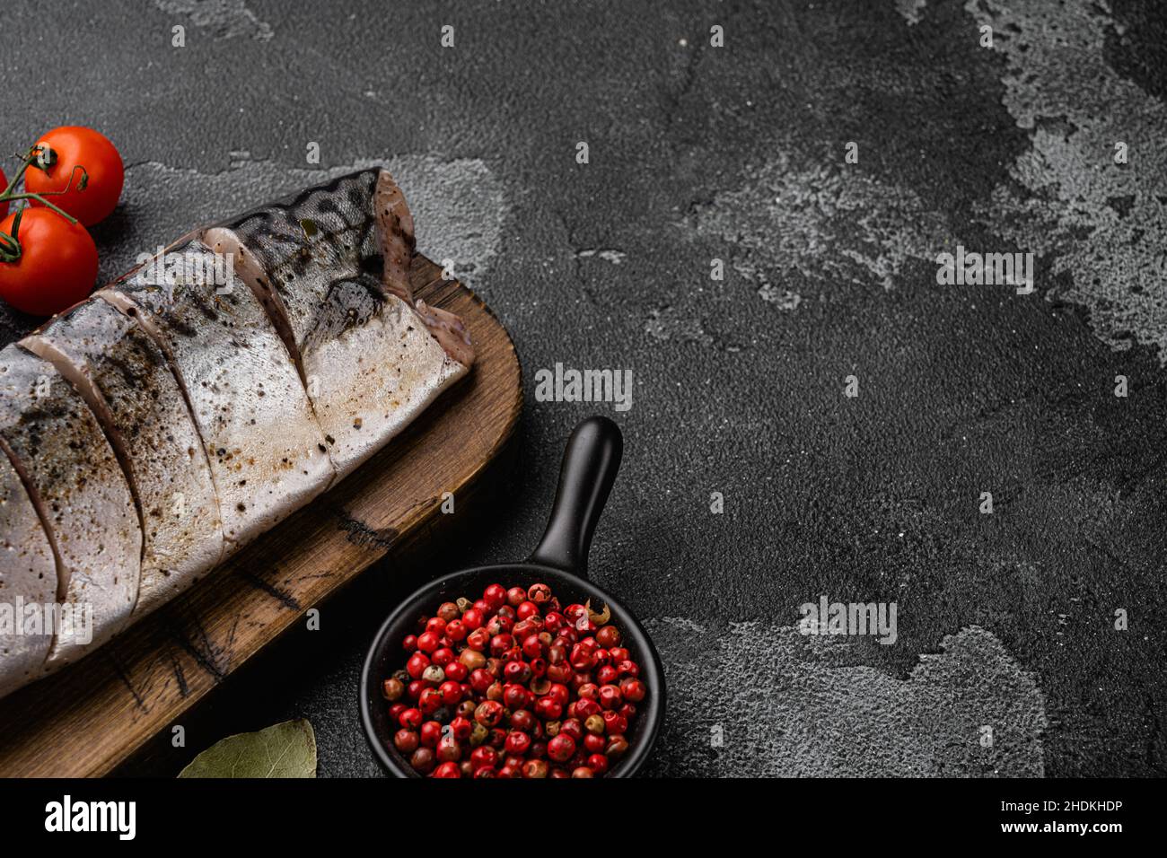 Marinated mackerel whole fish set, on black dark stone table background ...