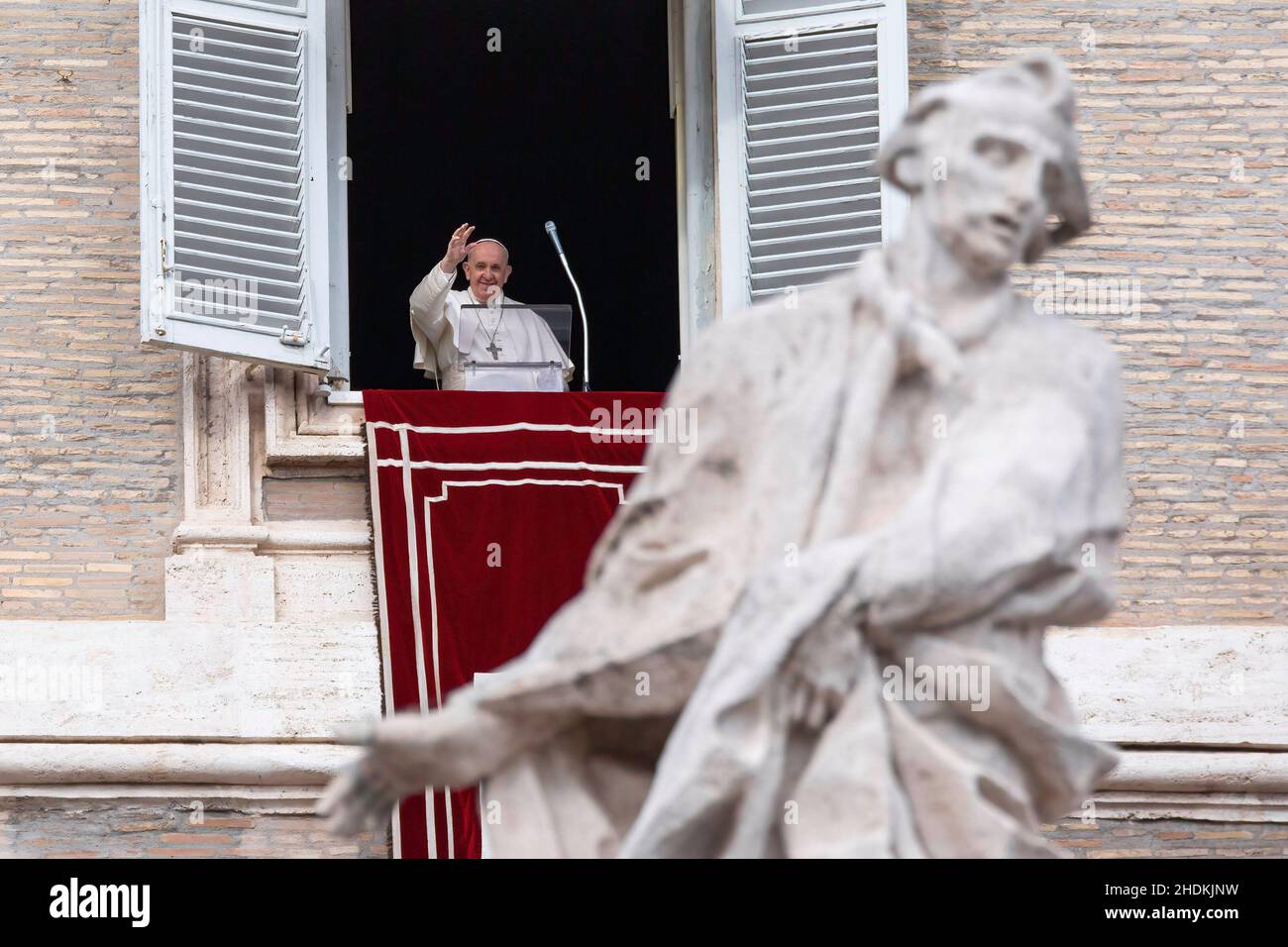 Pope Francis waves to the faithful during the Angelus prayer. Pope ...
