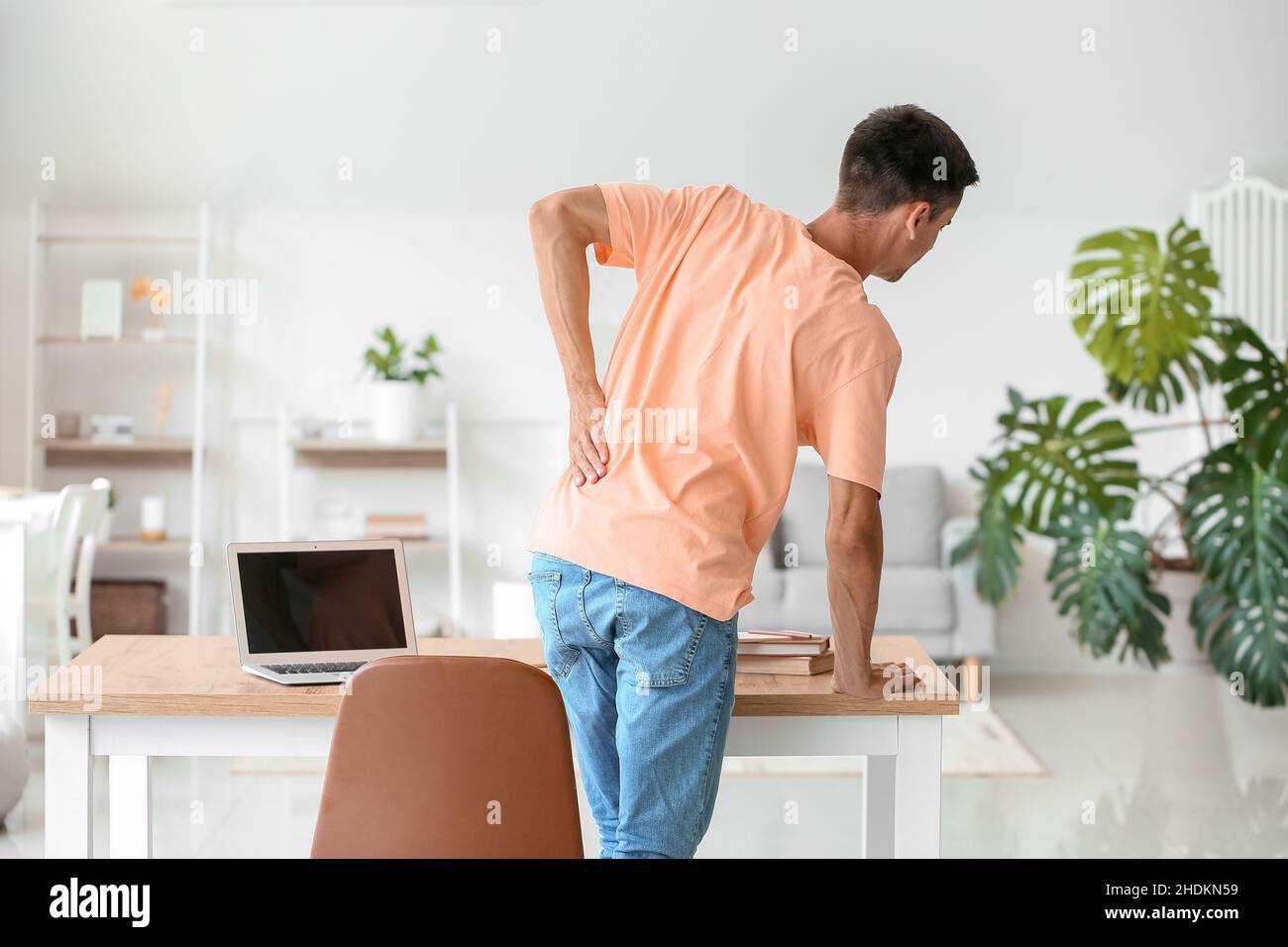 Man feeling lower back pain hi-res stock photography and images - Alamy