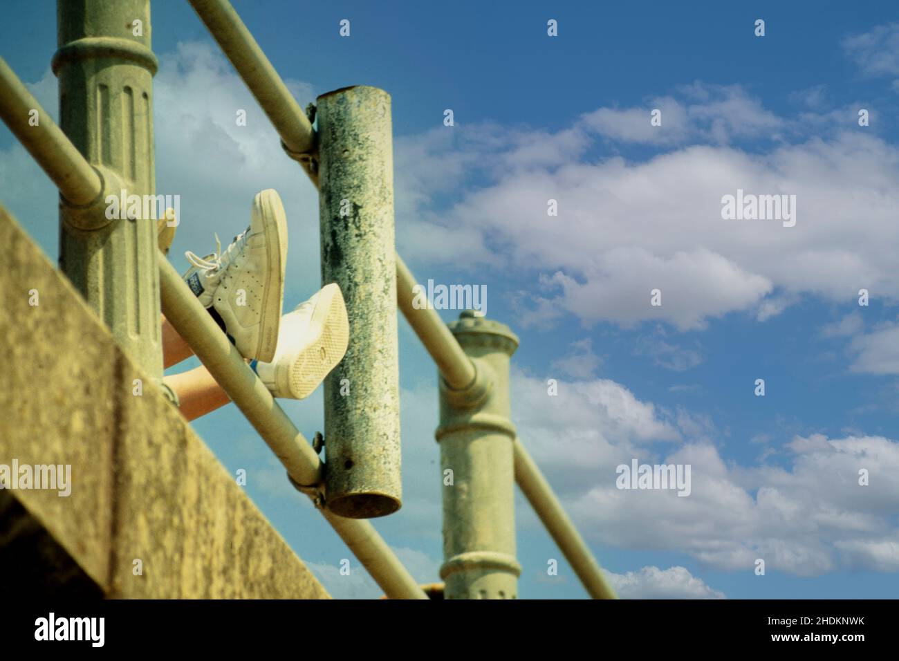 Trainers through railings hi-res stock photography and images - Alamy