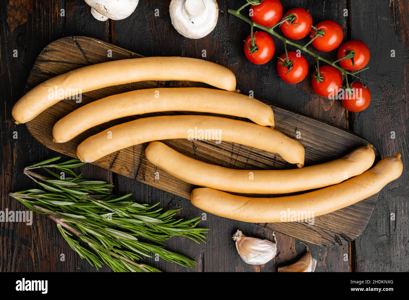 Thin wiener sausages set, on old dark wooden table background, top view ...