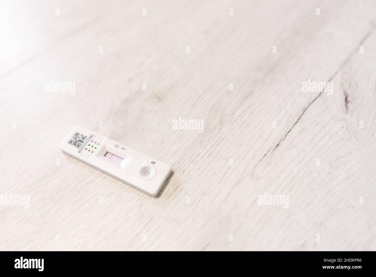 Negative test performed. A young woman doing the rapid antigen test at ...