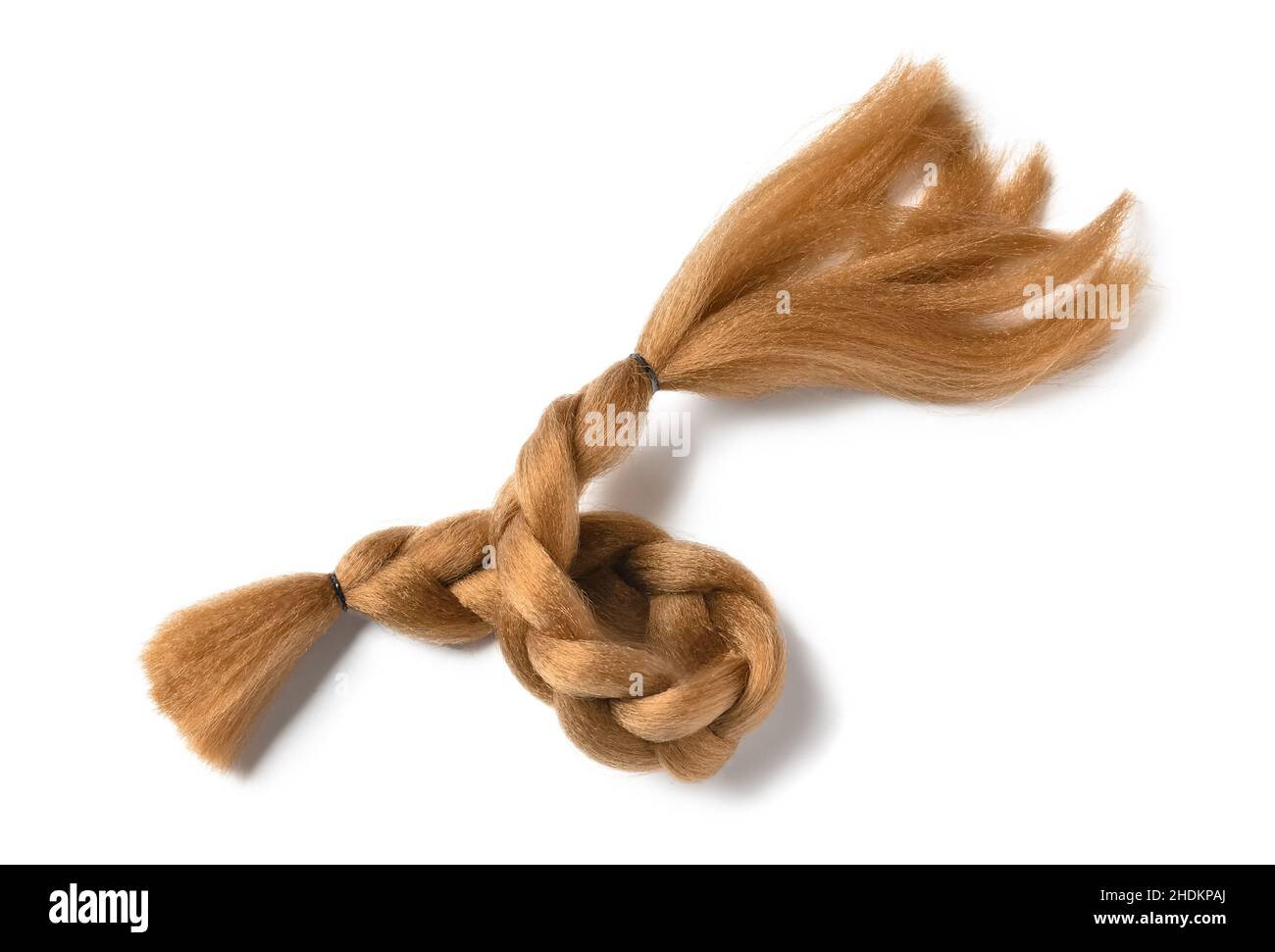 Braided red hair for donation on white background Stock Photo - Alamy
