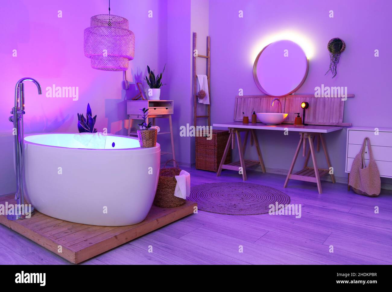 Interior of stylish bathroom with table, sink and neon lighting Stock ...