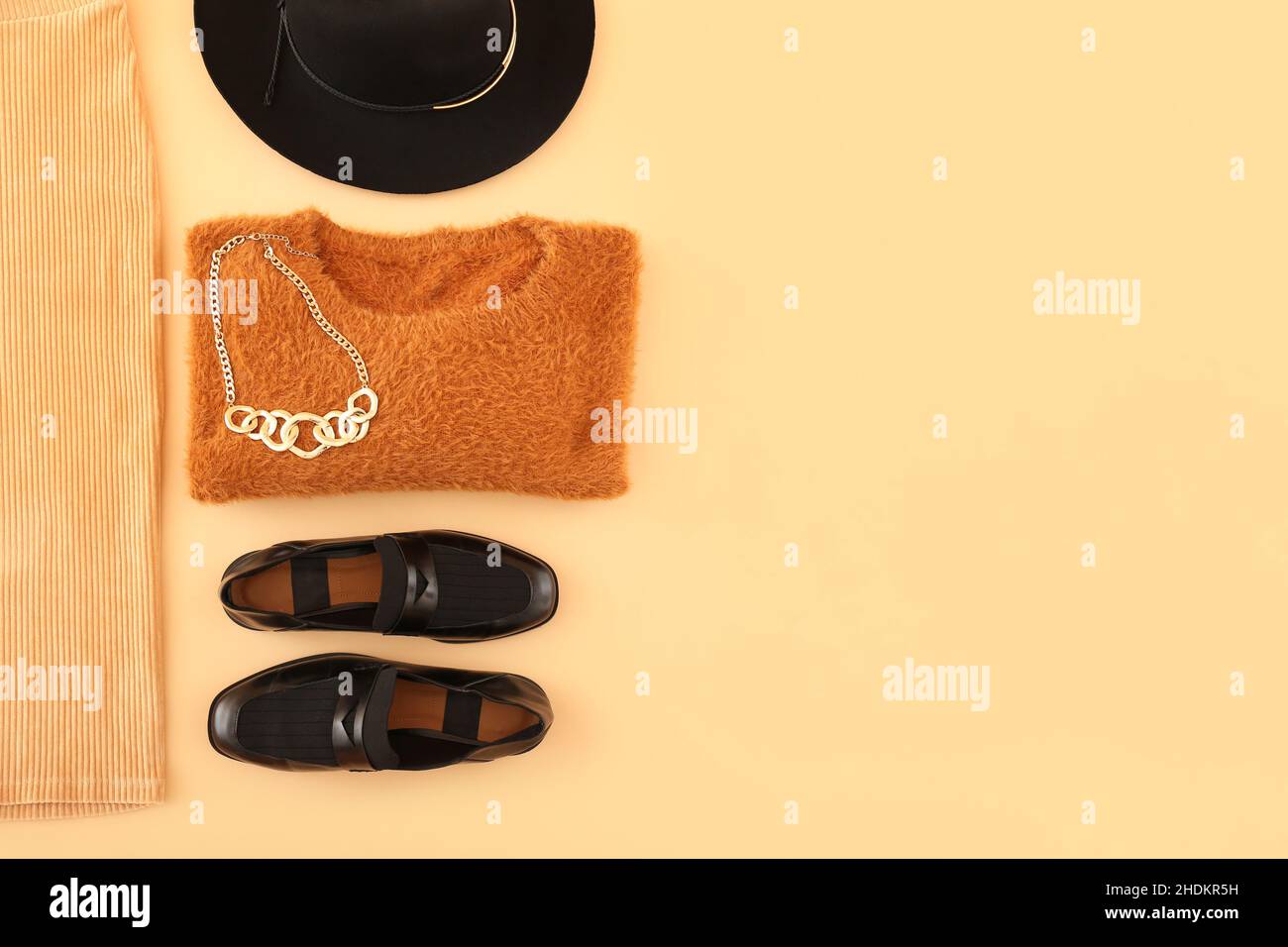Female clothes, accessories and shoes on color background Stock Photo ...