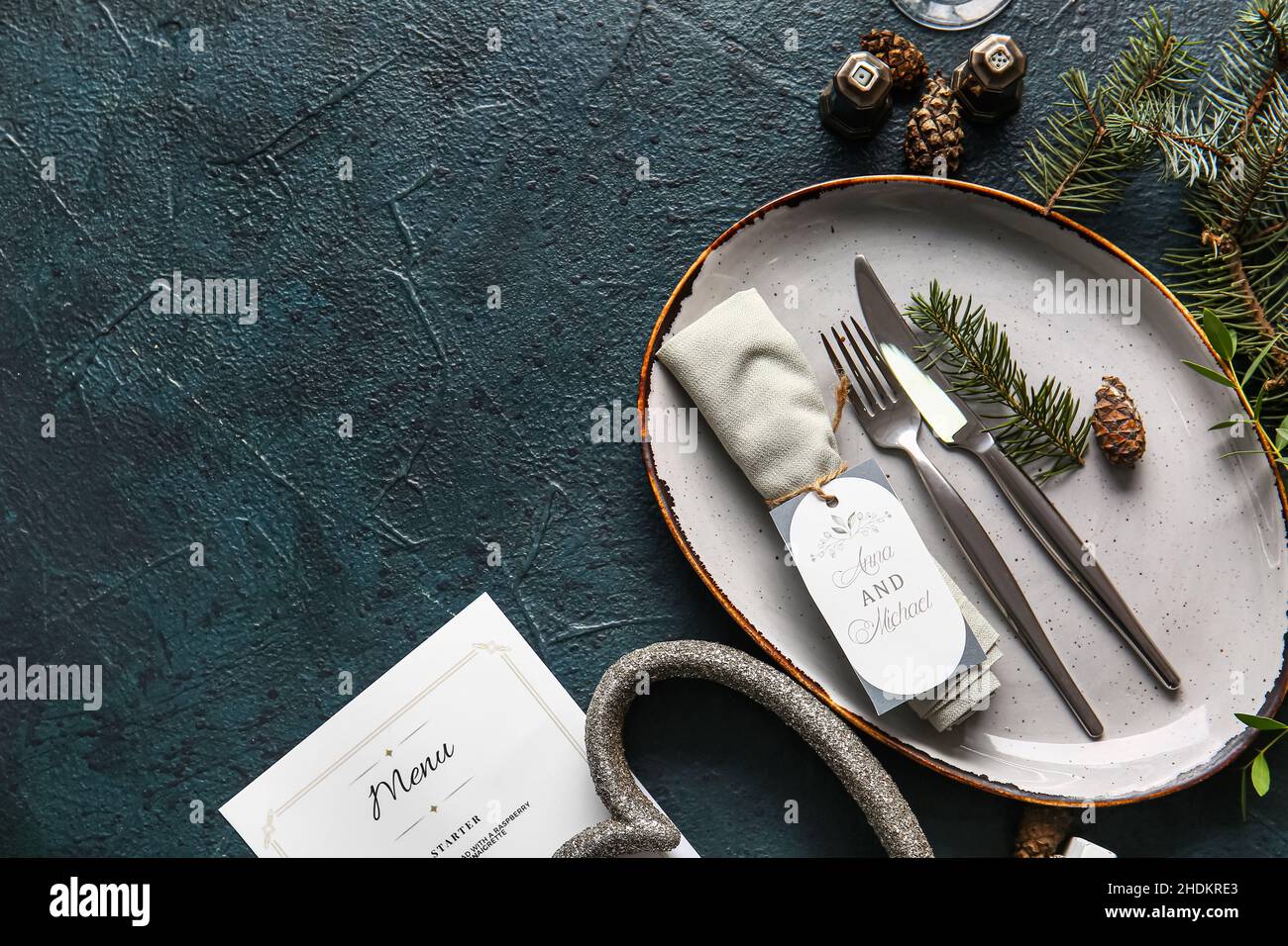 Beautiful table setting with wedding invitation on black background ...