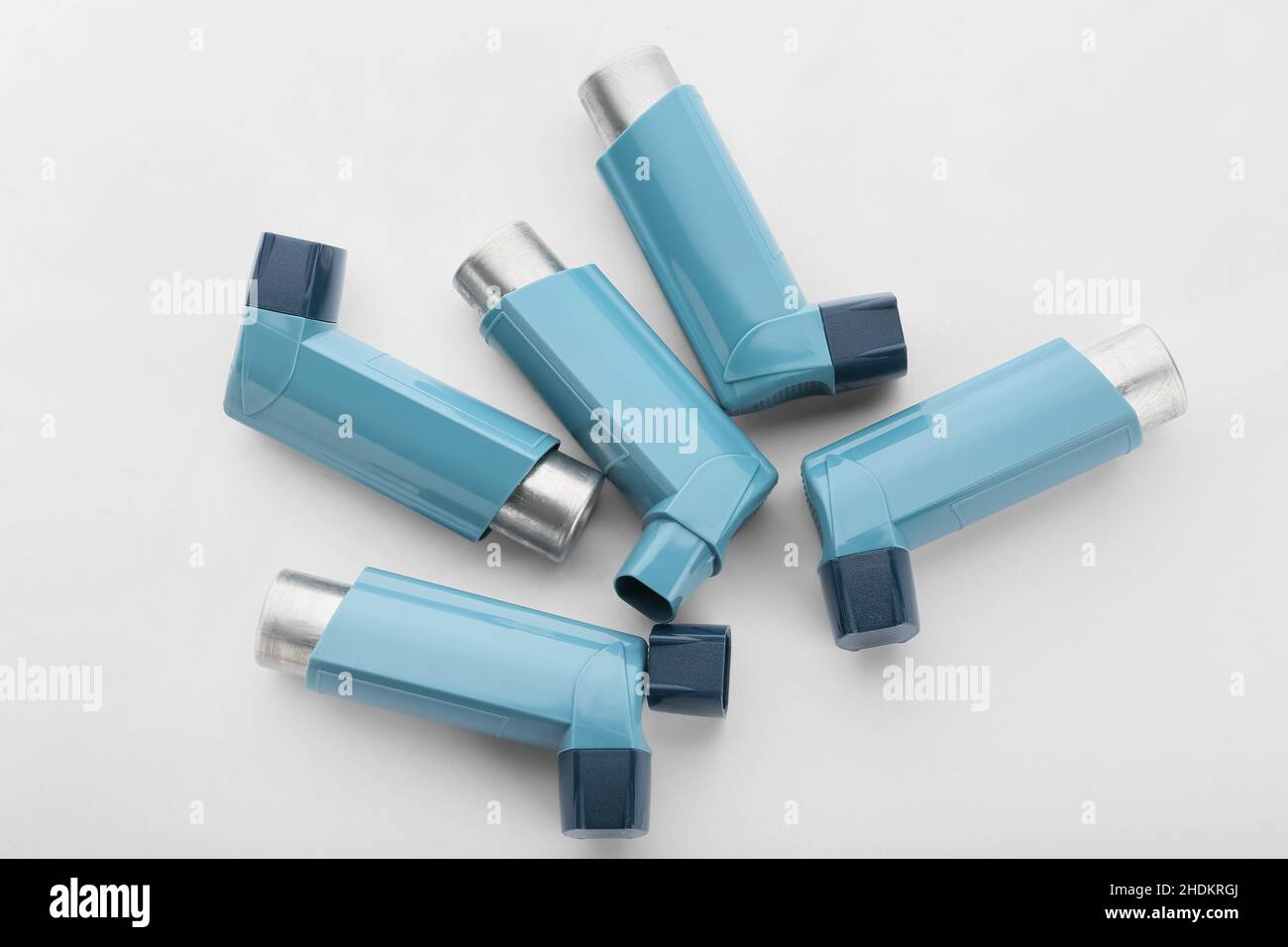 Asthma inhalers on white background Stock Photo - Alamy