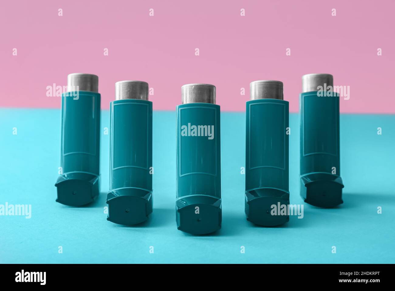 Asthma inhalers on color background Stock Photo - Alamy