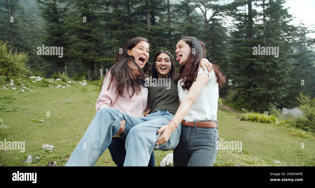 Group of young Indian female friends laughing and having fun together ...