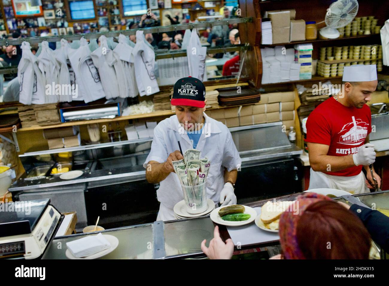 Workers behind counter at World famous Katz's Deli, located on the ...