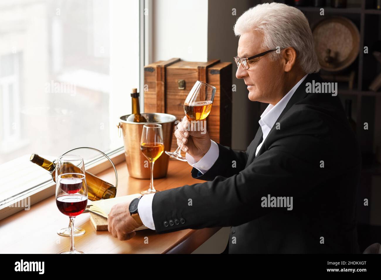 Mature sommelier tasting types of wine Stock Photo - Alamy