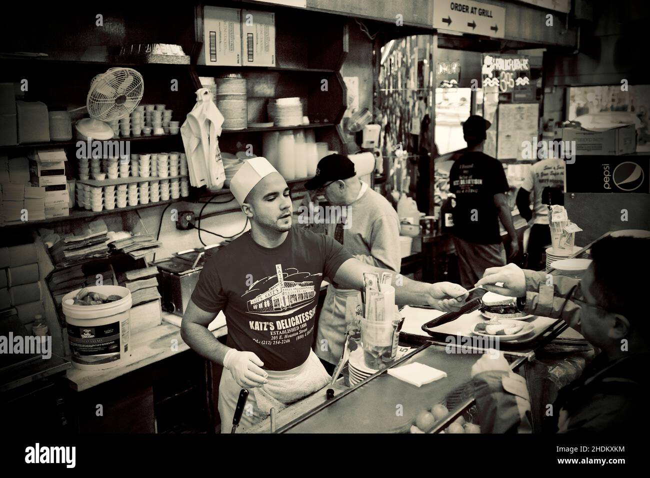 Workers behind counter at World famous Katz's Deli, located on the ...