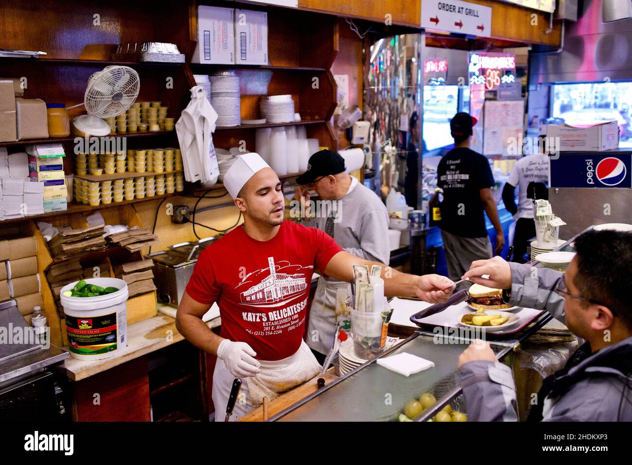 Workers behind counter at World famous Katz's Deli, located on the ...