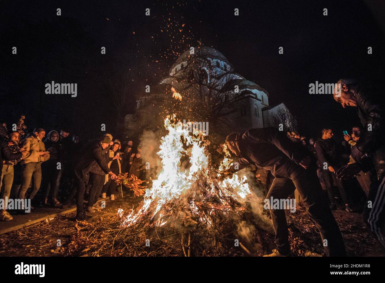 Traditional bonfire during Orthodox Christmas Eve. Temple of Saint Sava ...