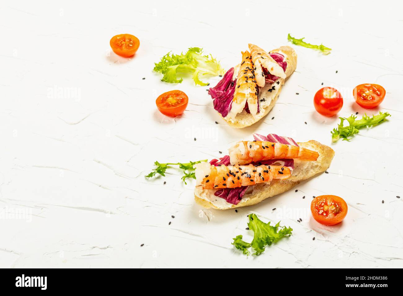 Open sandwiches with boiled shrimps, cream cheese, salad leaves and ...