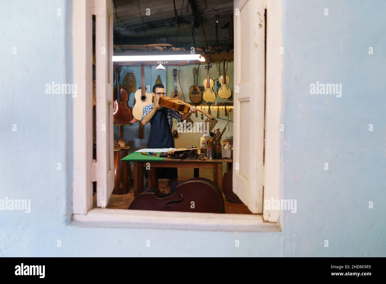 instrument maker, guitar builder, instrument makers Stock Photo - Alamy