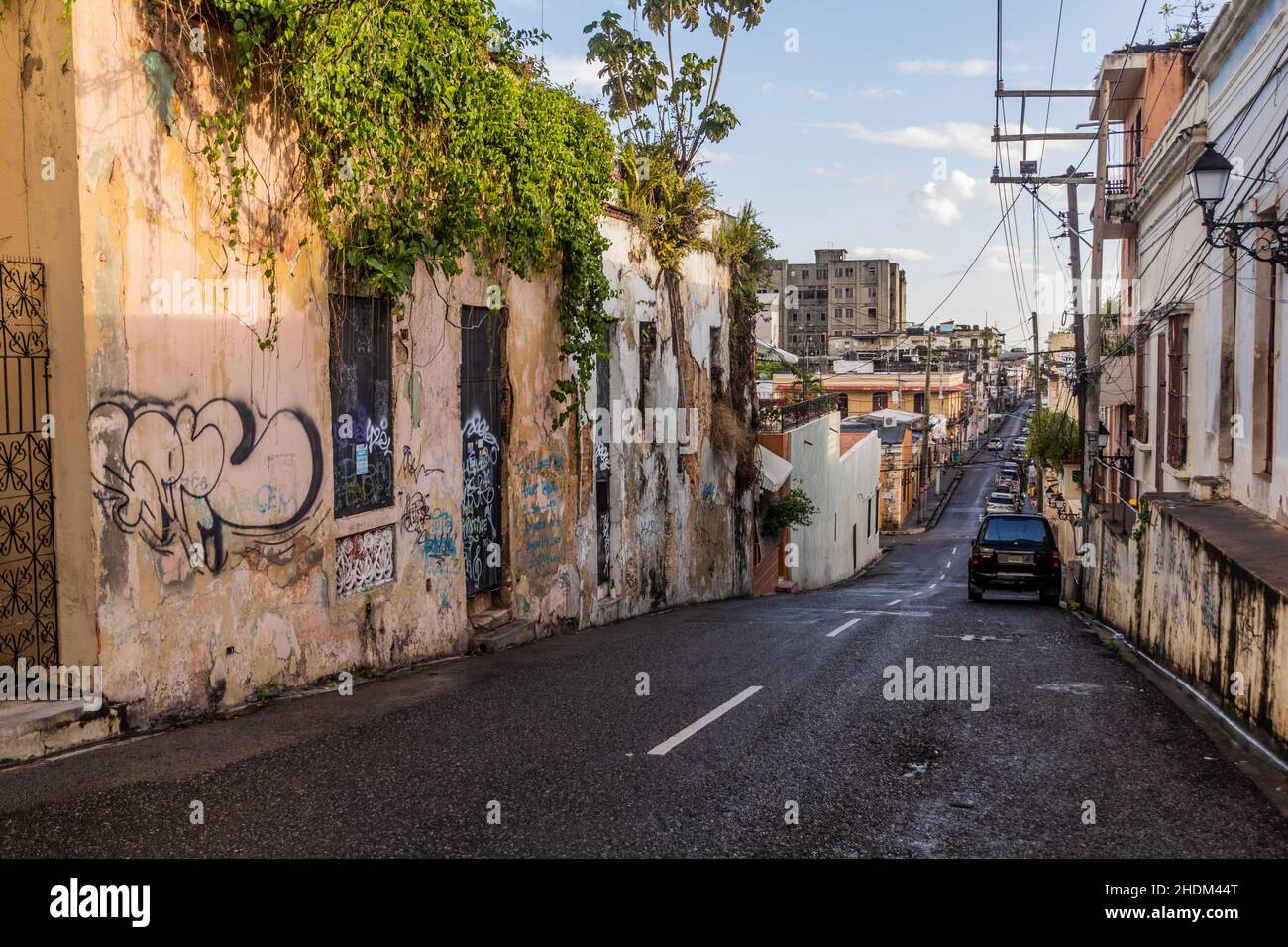 SANTO DOMINGO, DOMINICAN REPUBLIC - NOVEMBER 10, 2018: Narrow street in ...