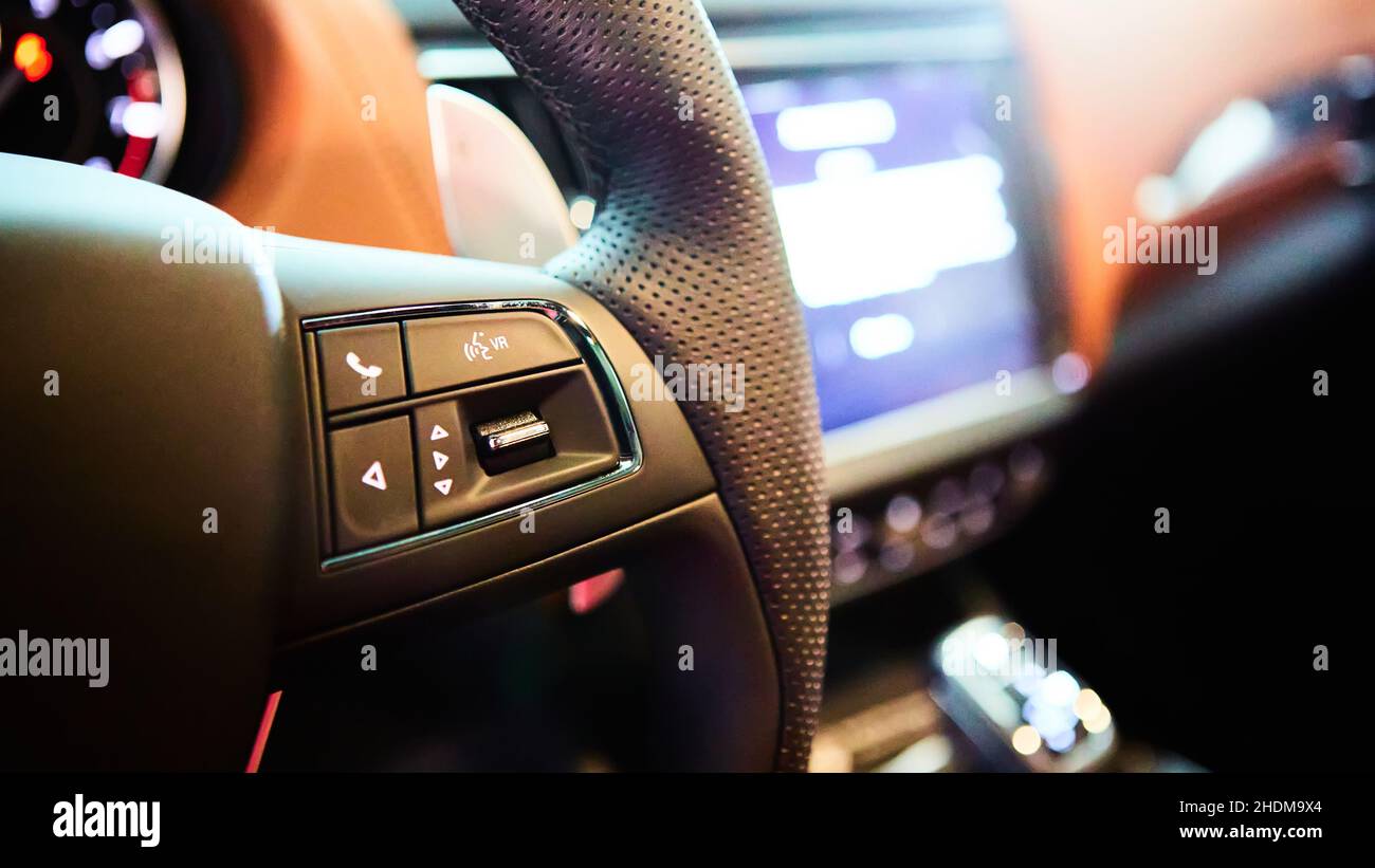 Close up steering wheel with multi function button. Luxury car interior ...