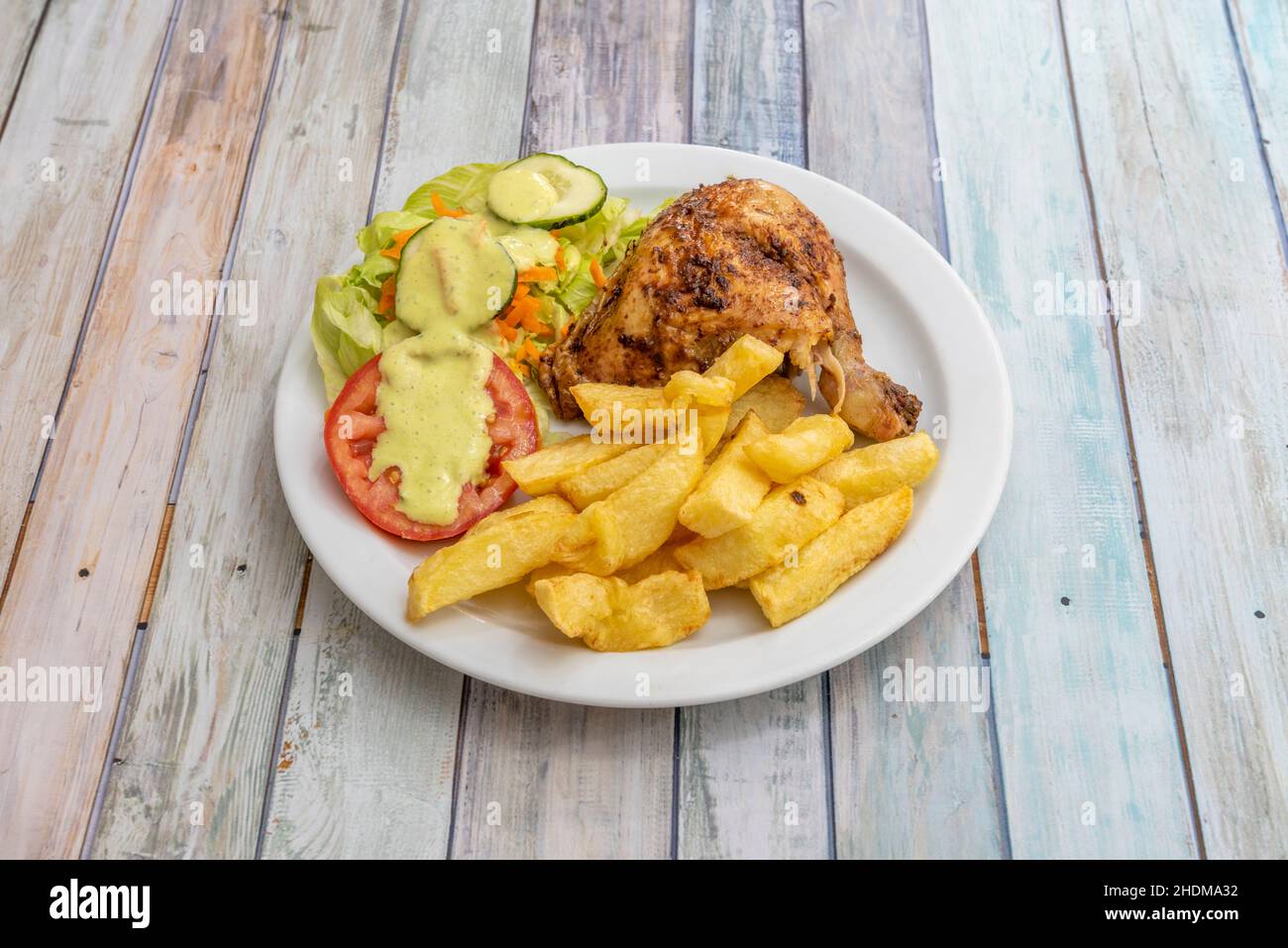 Roast chicken quarter menu with homemade chips and tomato salad and ...