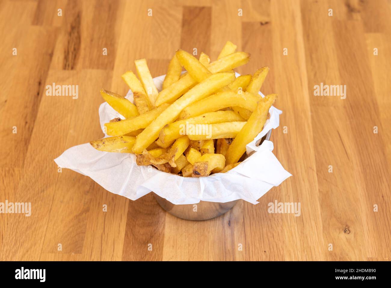 French fries are prepared by cutting them into slices or sticks and ...