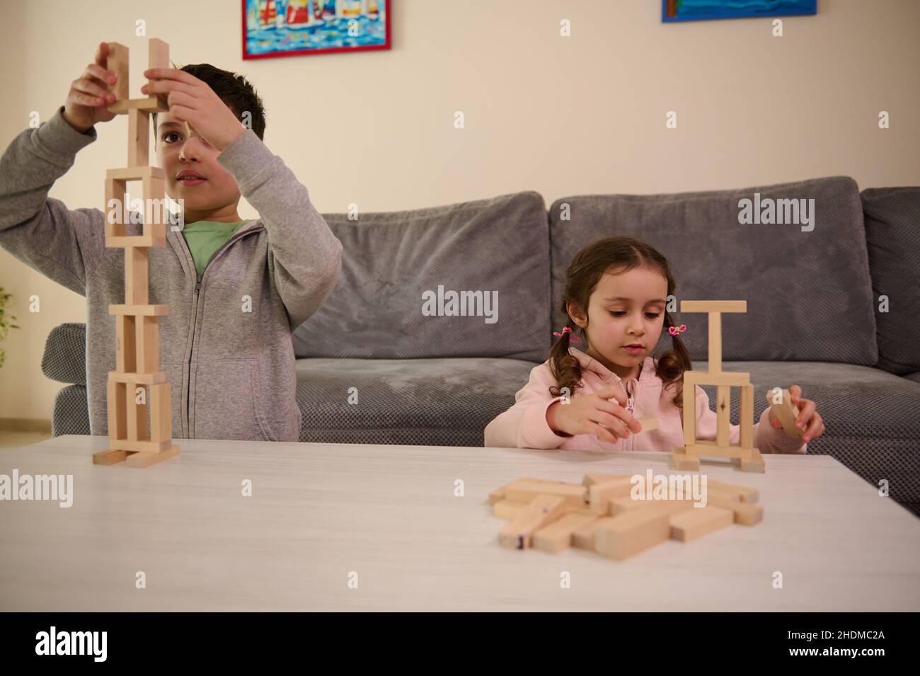 Adorable kids playing together blocks hi-res stock photography and ...