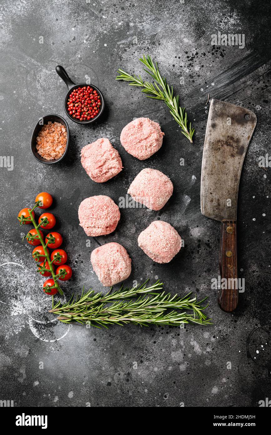 Fresh raw turkey meatballs, on black dark stone table background, top ...