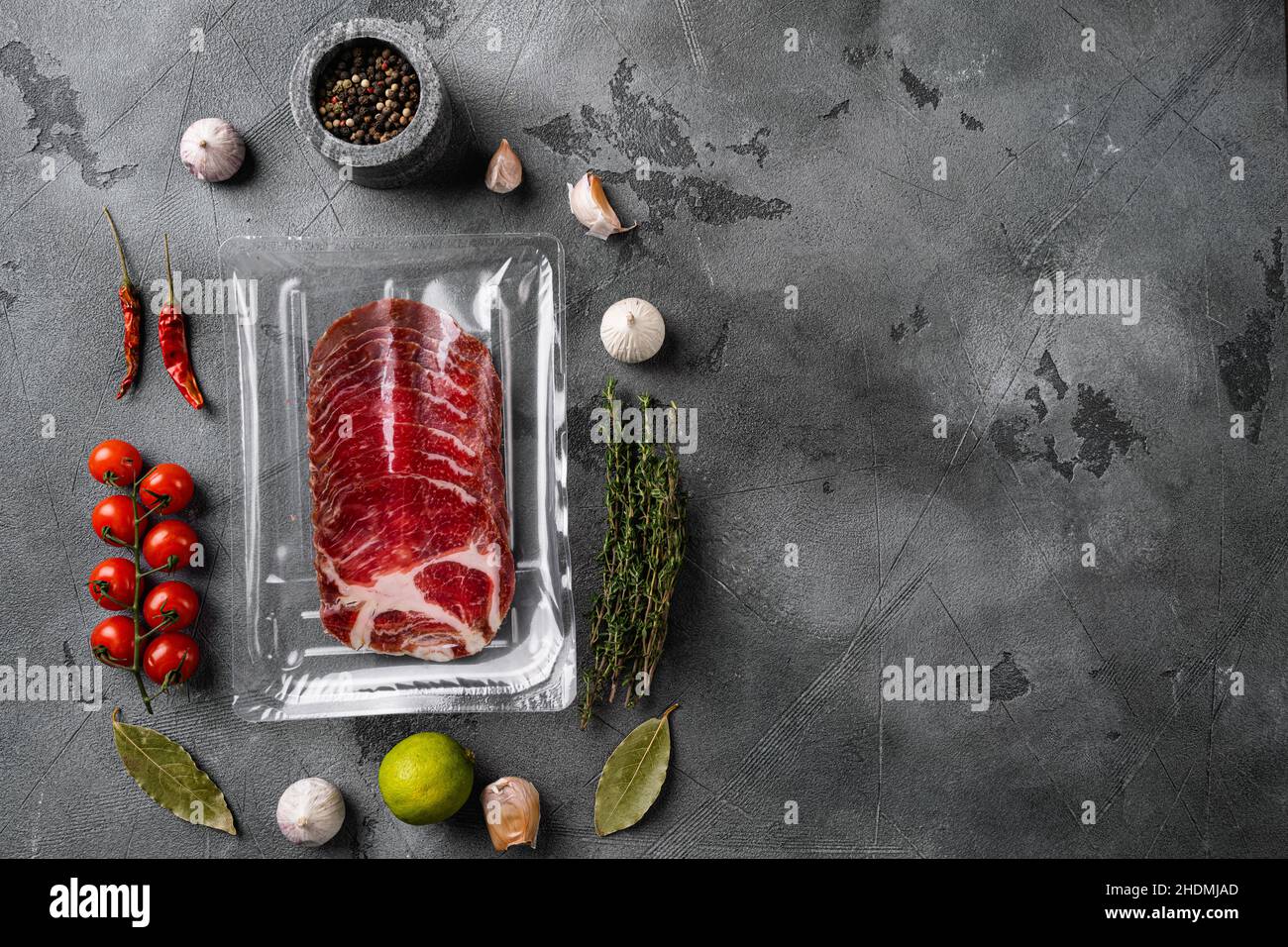Italian dry cured ham vacuum pack, on gray stone table background, top ...