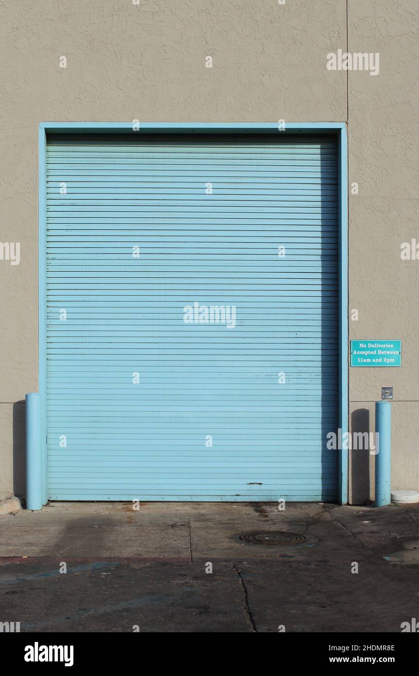 Garage Door on Warehouse and Regular Door Industrial Background Stock ...