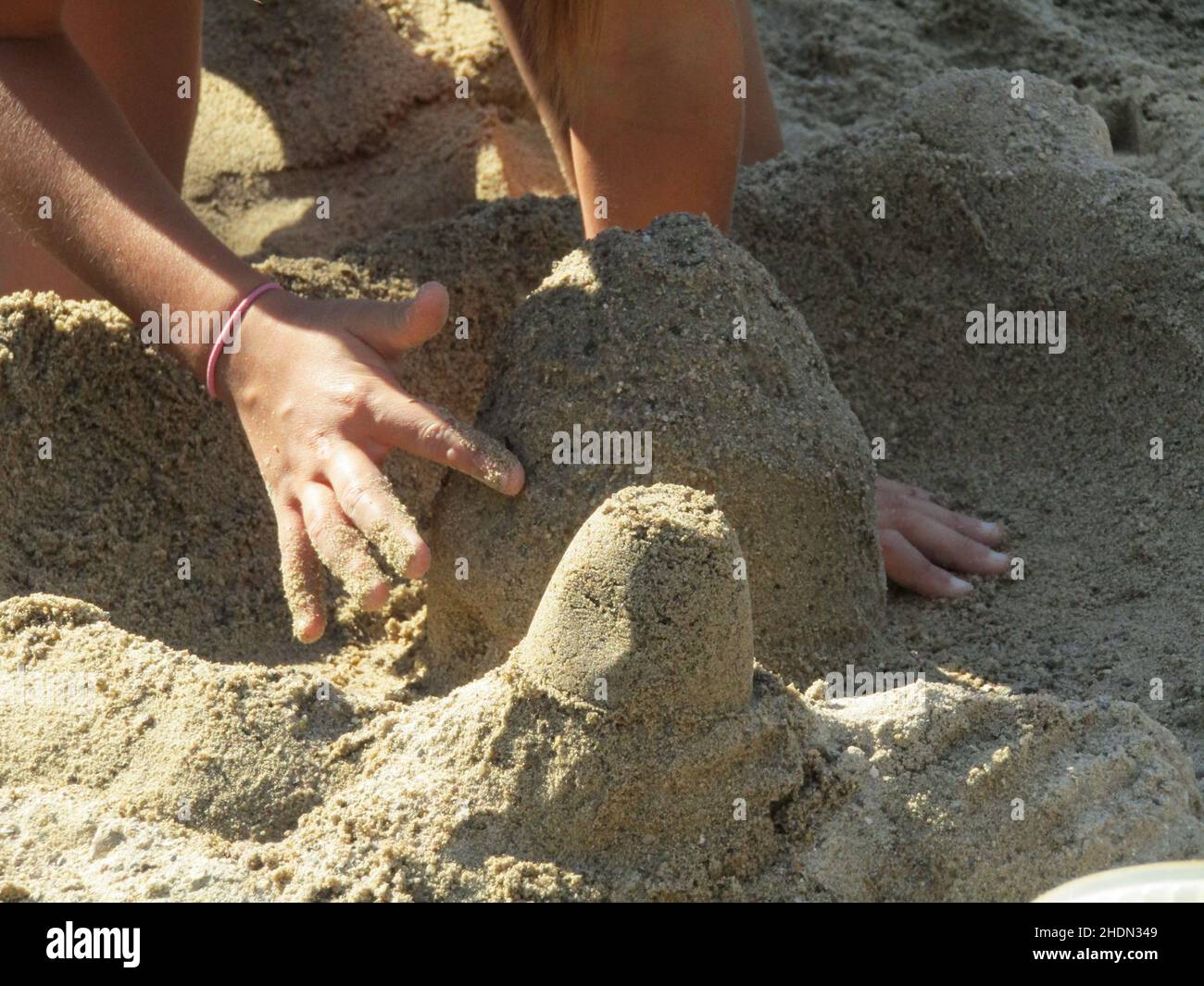 Child hand building sand castle hi-res stock photography and images - Alamy