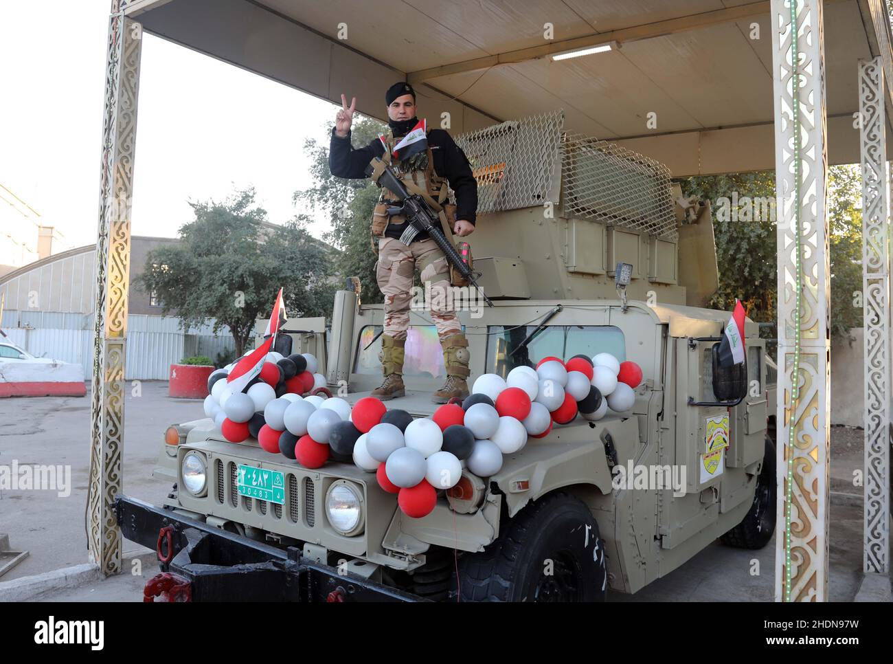 Baghdad. 6th Jan, 2022. An Iraqi soldier gestures during a celebration ...