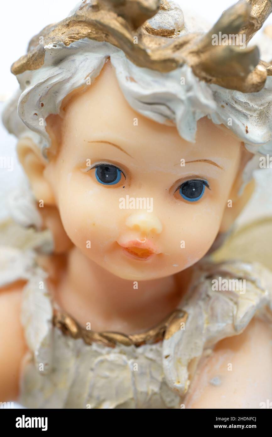 Vertical shot of a baby angel figurine on a white background Stock ...