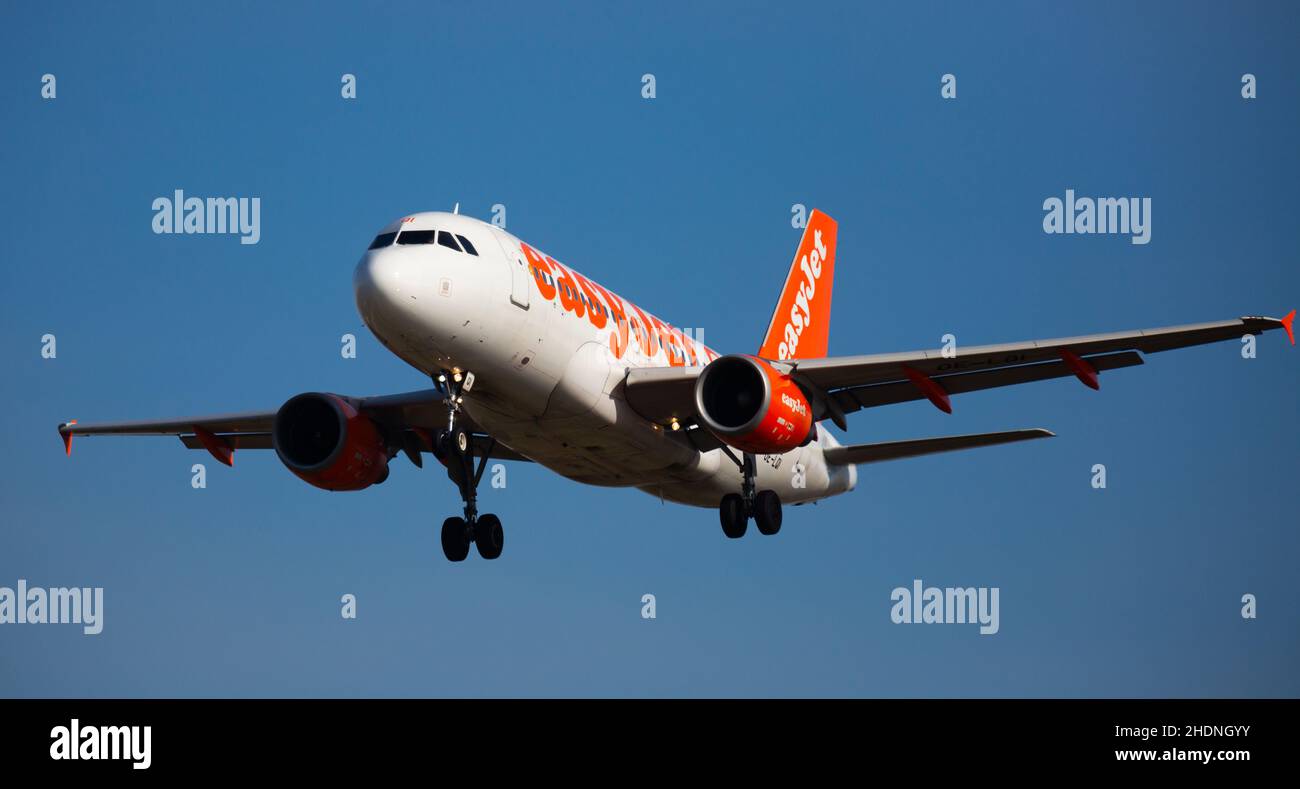 Airline EasyJet plane comes in for a landing in an aeroport El Prat ...