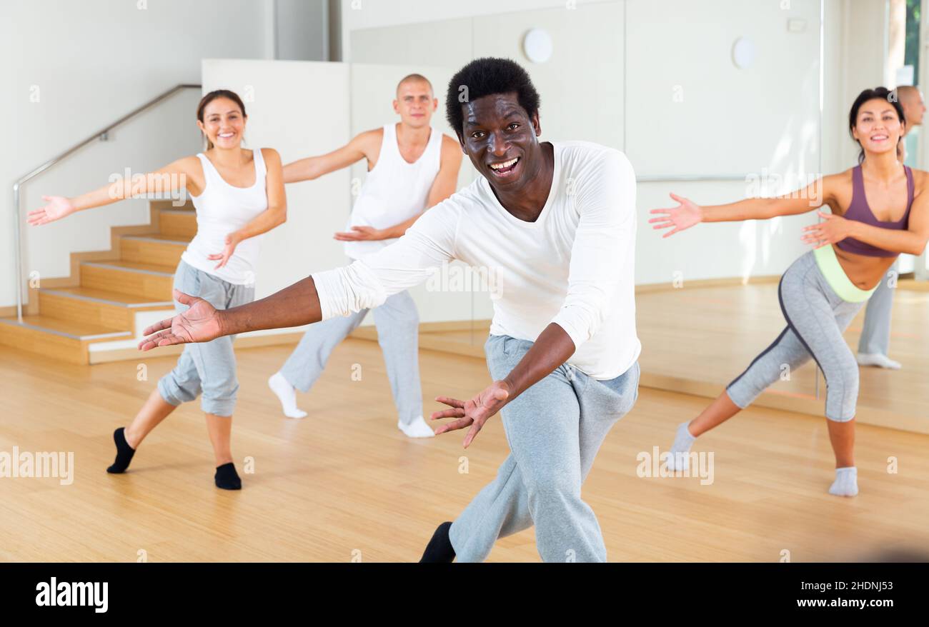 Group of multinational people practicing dance techniques Stock Photo ...