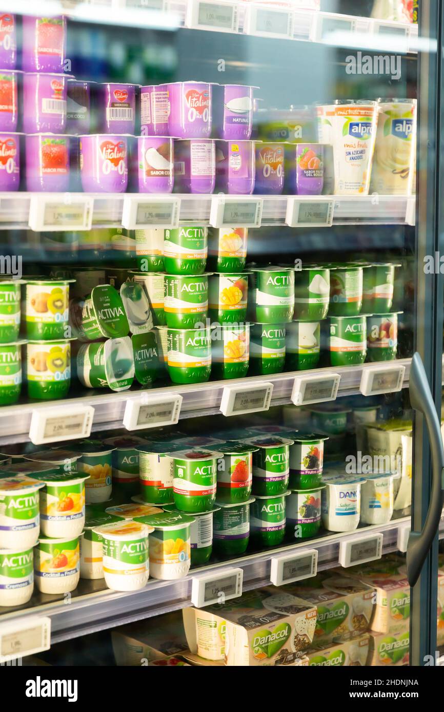 Assortment of various yogurts on store shelves Stock Photo - Alamy