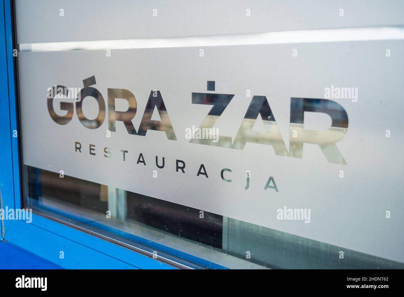 Window of the restaurant from a Gora Zar with the words "Gora Zar ...