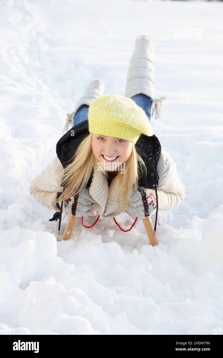 young woman, sledding, girl, girls, woman, young women Stock Photo - Alamy