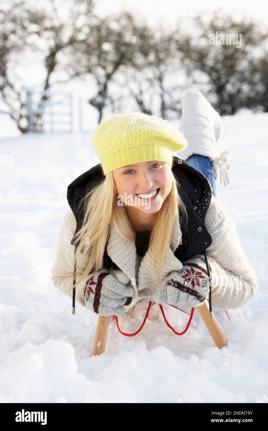 young woman, sledding, girl, girls, woman, young women Stock Photo - Alamy