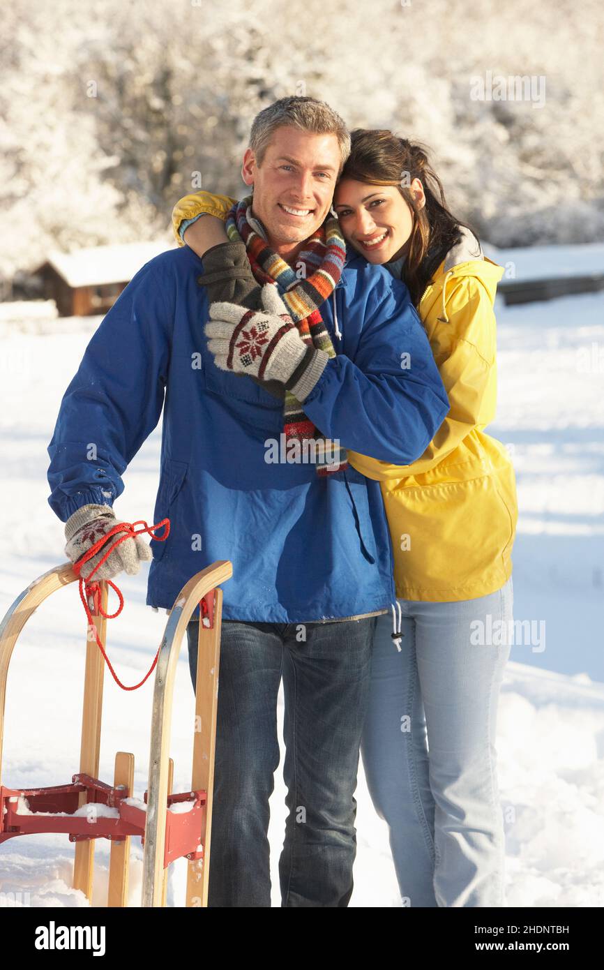 Couples hugging outdoors snow hi-res stock photography and images - Alamy