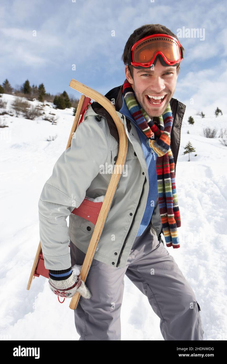 young man, sledding, winter holidays, guy, man, men, young Stock Photo ...