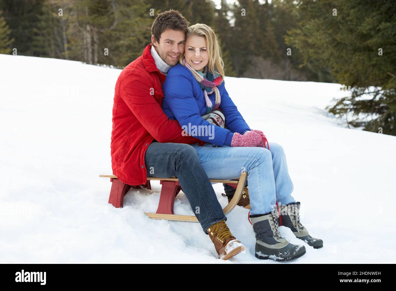 sledding, love couple, love couples Stock Photo - Alamy