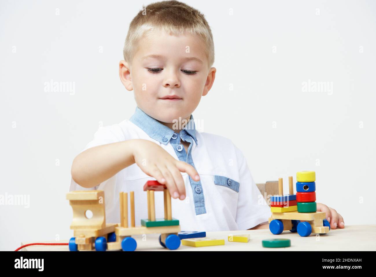 Male blonde child playing hi-res stock photography and images - Alamy
